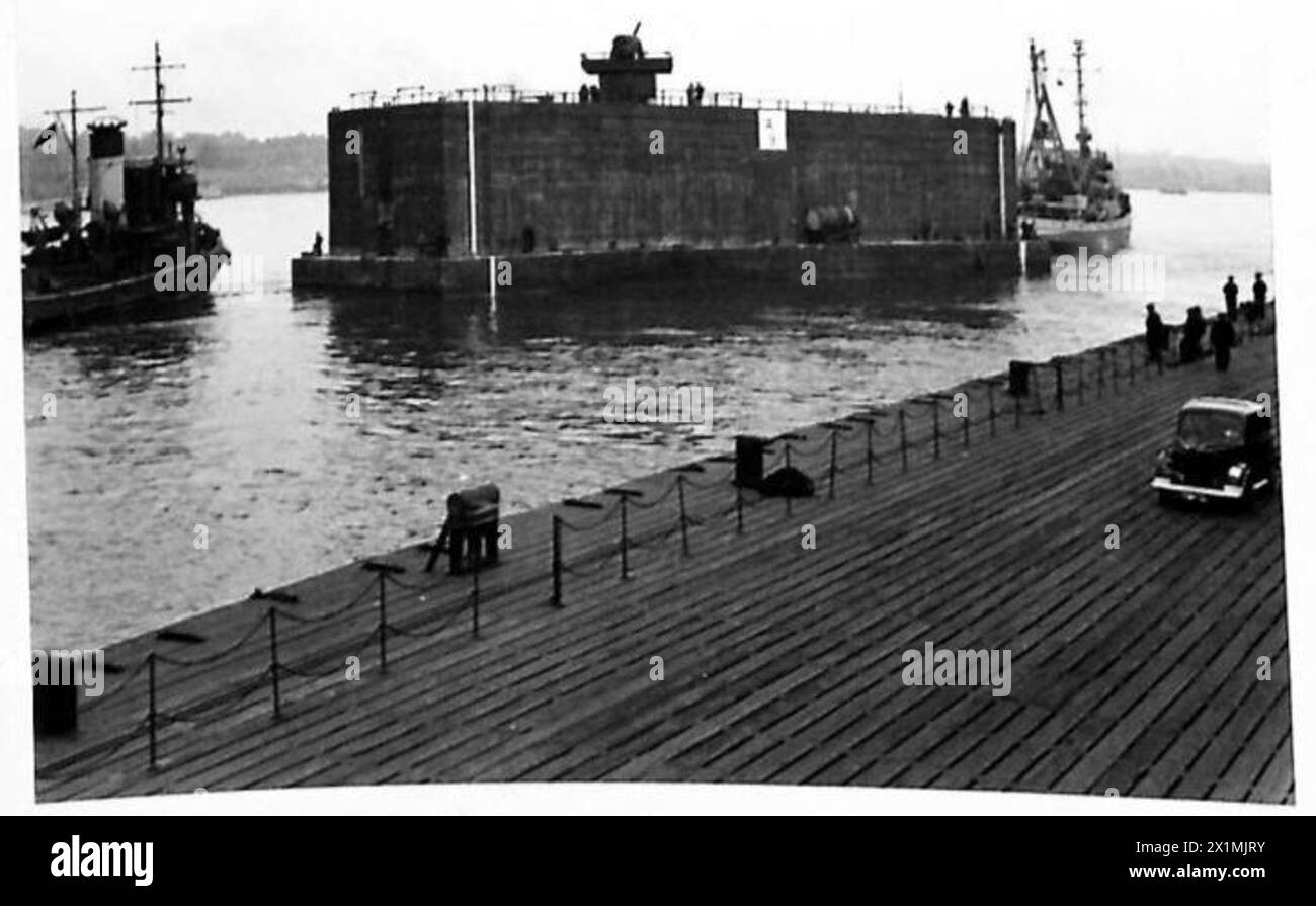 Photographs show the towing and docking of the Phoenix vessel at ...