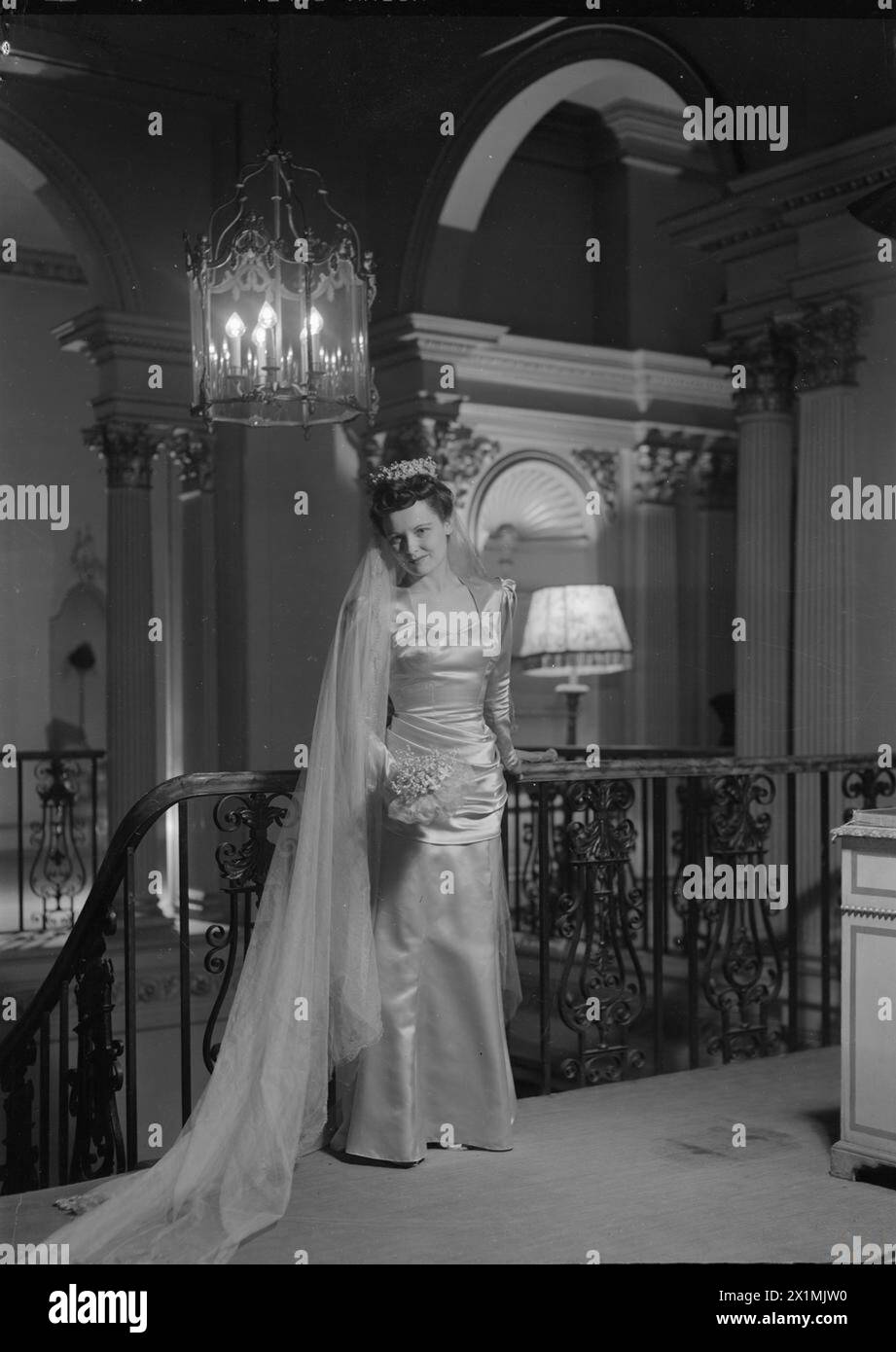 Actress Peggy Bryan models a wedding dress designed by Bianca Mosca ...