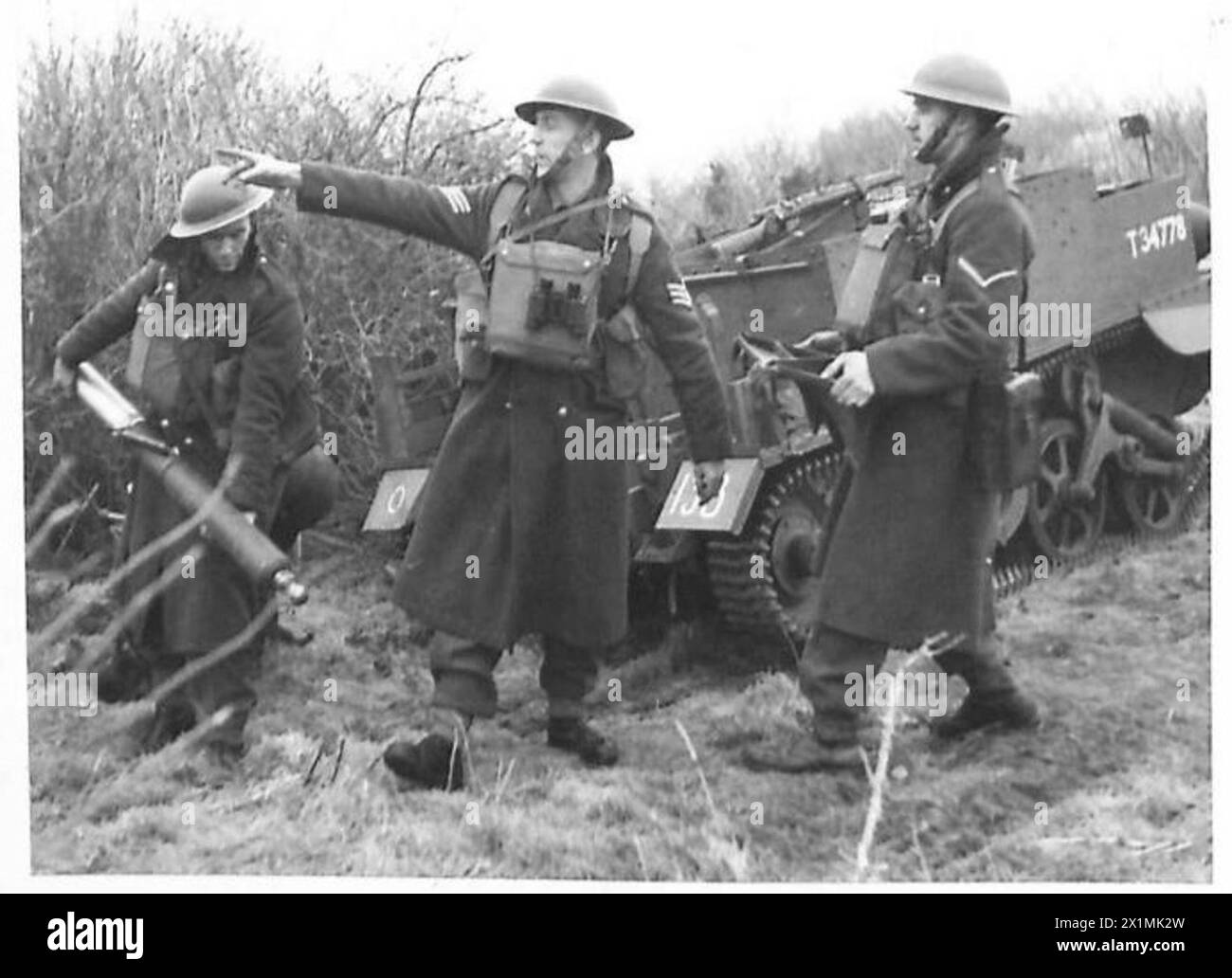 Bren carrier sections of a Reconnaissance Company deploy three-inch ...