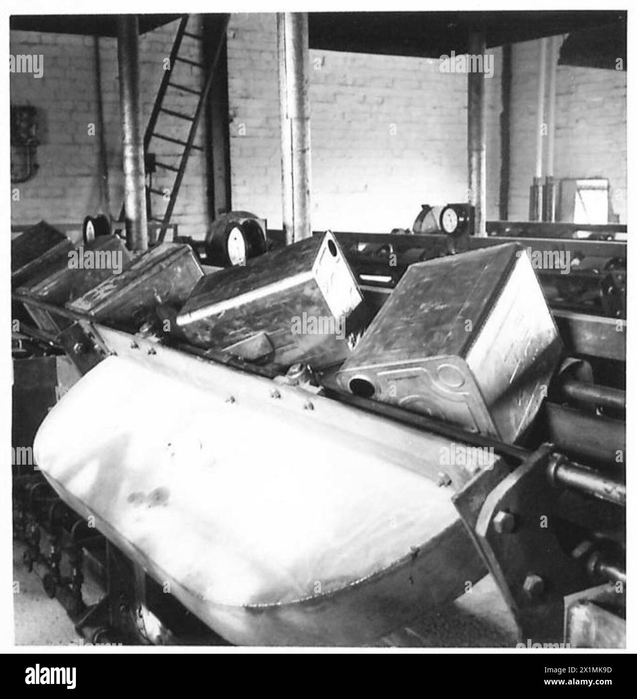 Machinery operates in a can factory near Gloucester under supervision ...