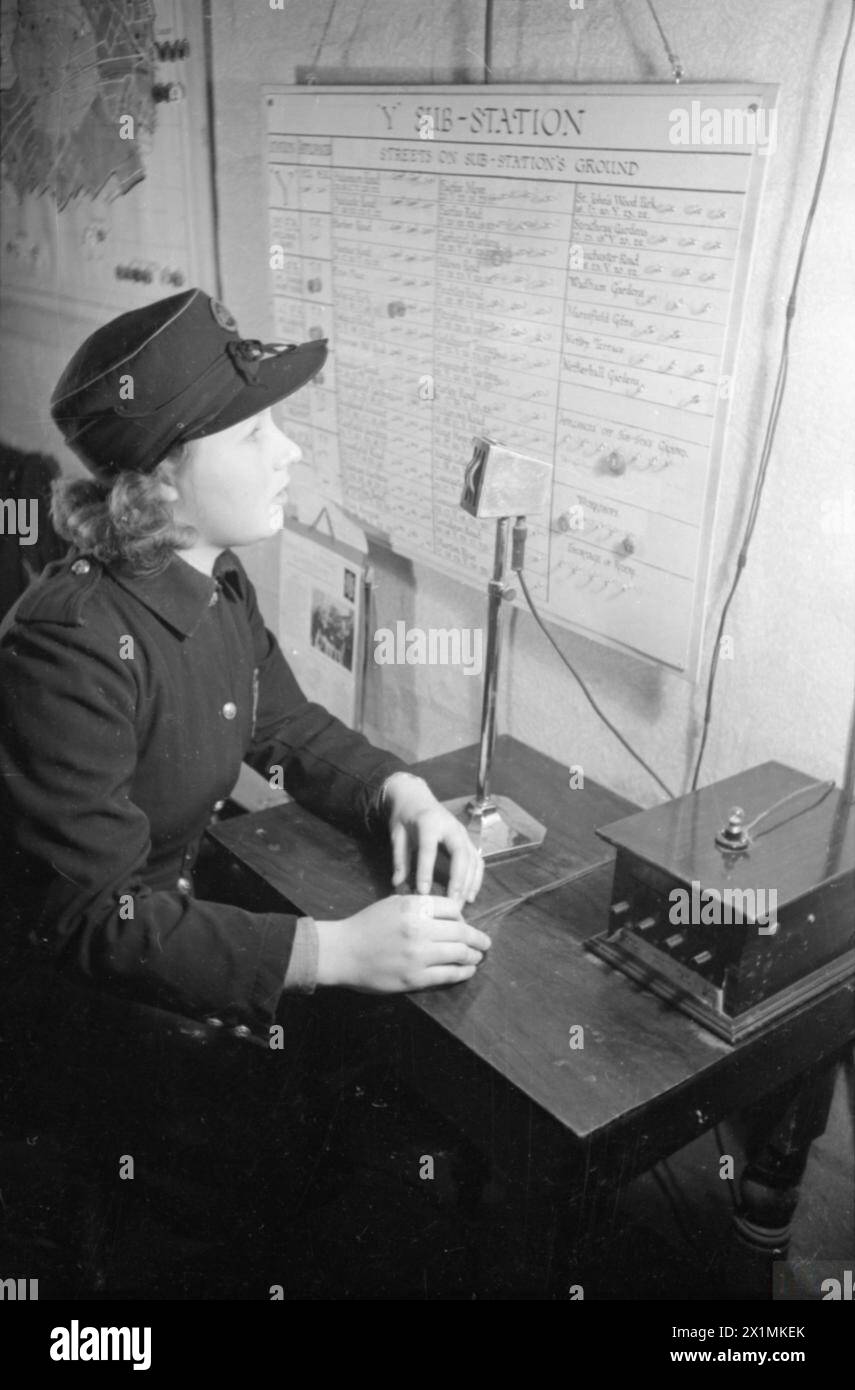 A female Auxiliary Fire Service member at London Fire Brigade ...