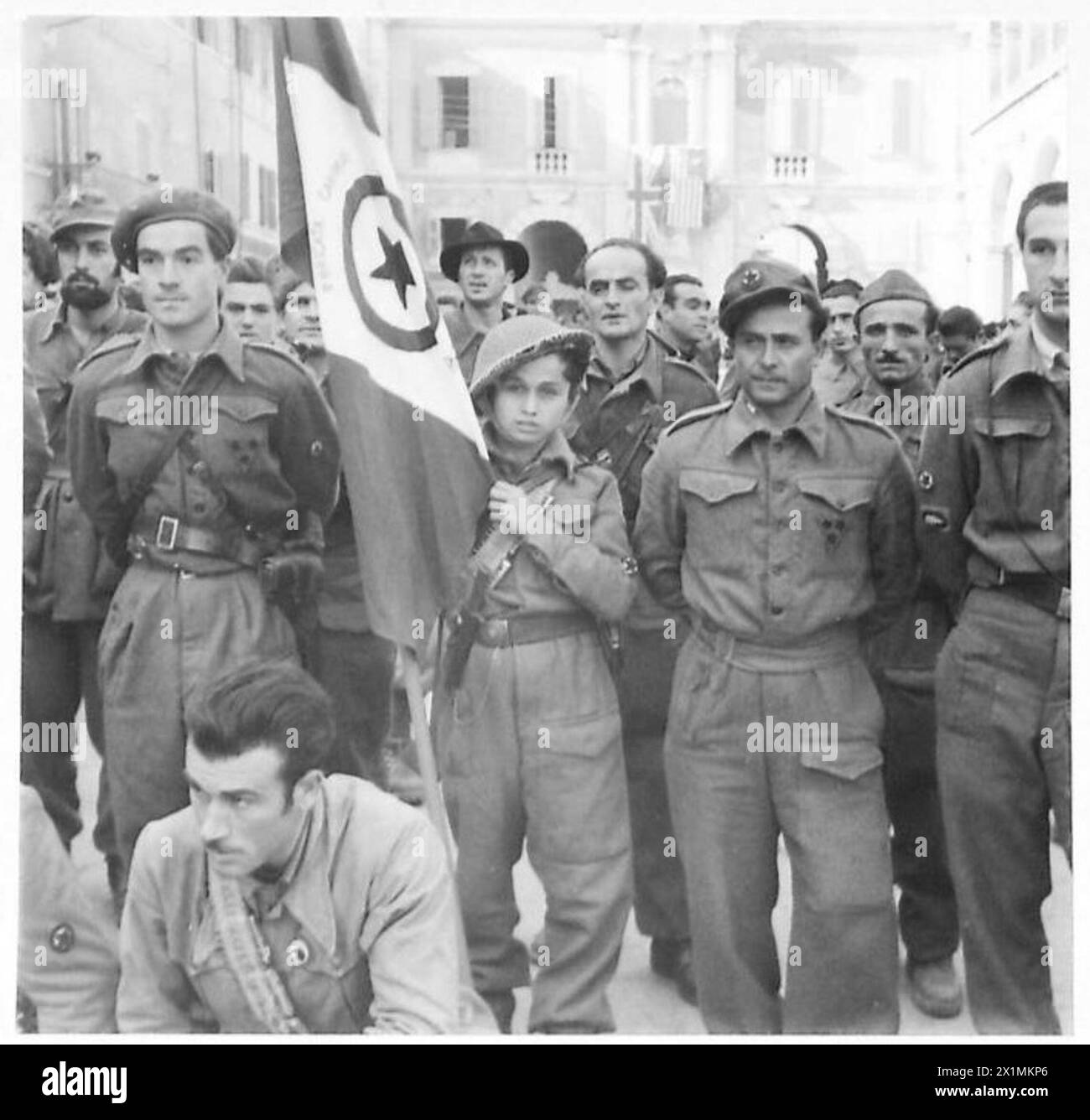 ITALY : PARTISANS - The Partisan flag, with (left) the Commander of the ...