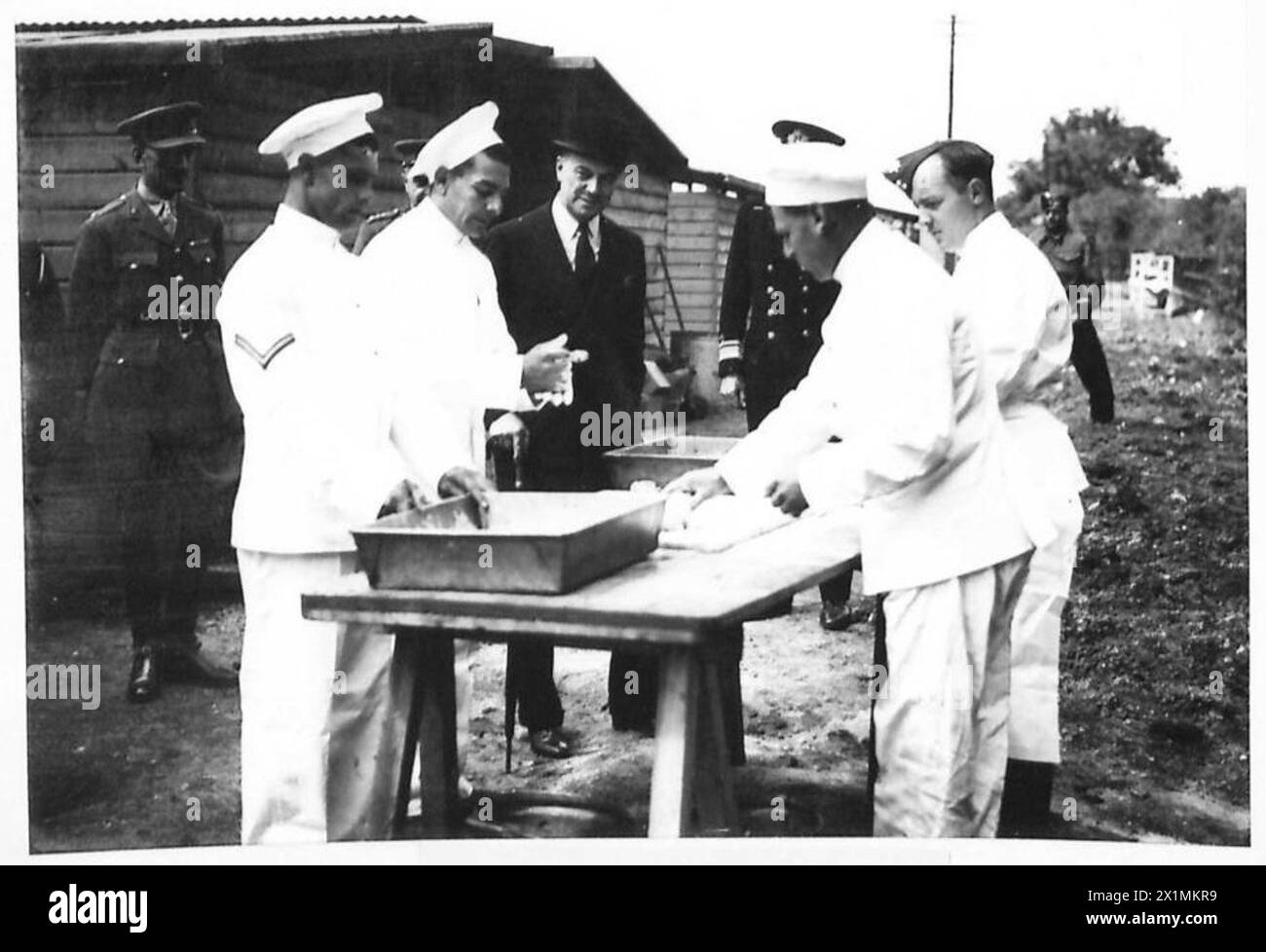 The Colonial Secretary observes Cypriot troops and cooks preparing a ...