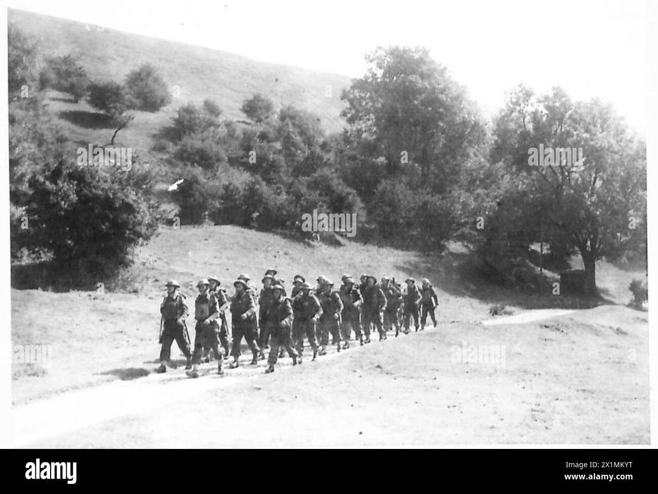 ROUNDING UP ENEMY PARACHUTISTS - Marching back to quarters, British ...