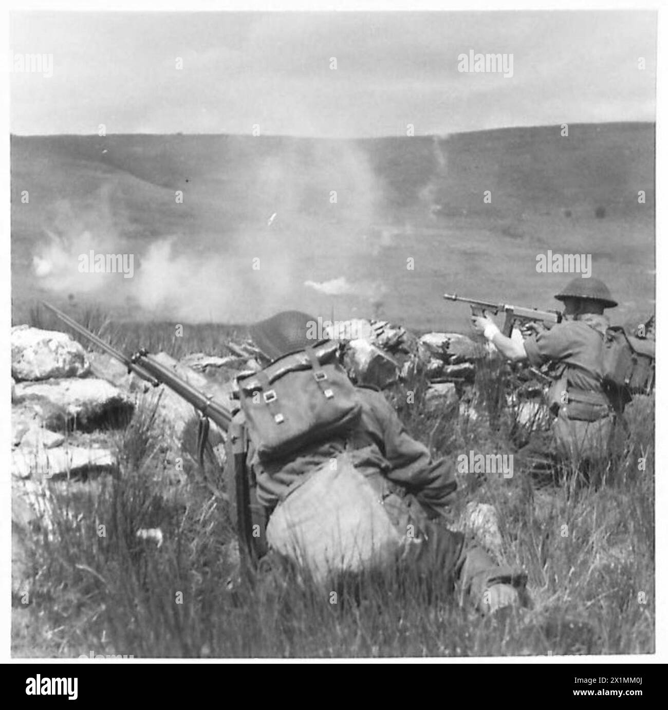 SCHOOL OF BATTLE DRILL - Under cover of a heavy smoke screen, these men ...