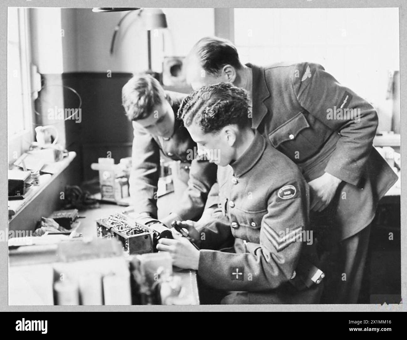 Air Training Corps cadets learn the operation of an aircraft radio set ...
