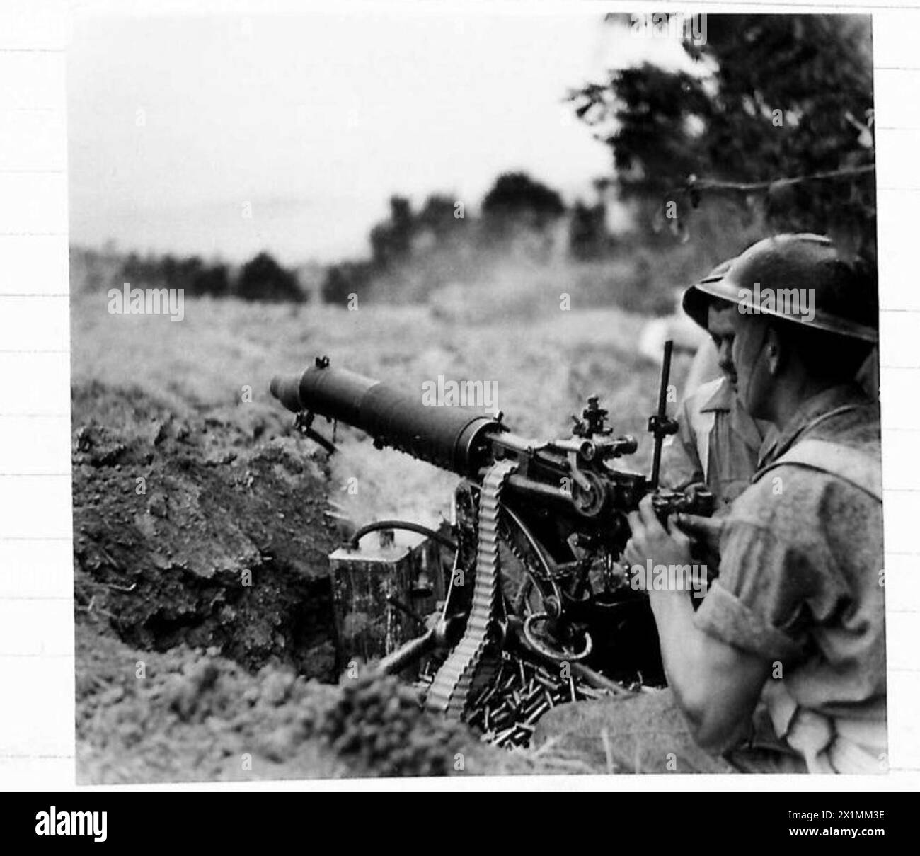 Vickers machine-guns of the 6th Battalion, Cheshire Regiment fire over ...