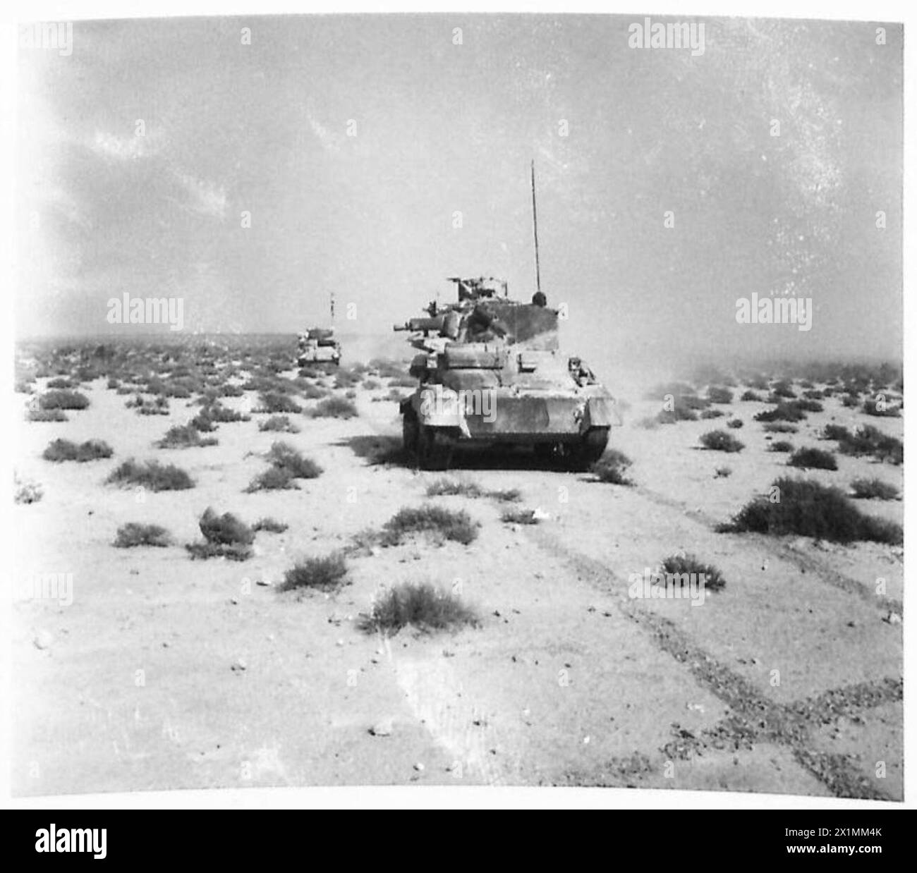 Light tanks of the British Army are positioned on patrol in front of ...