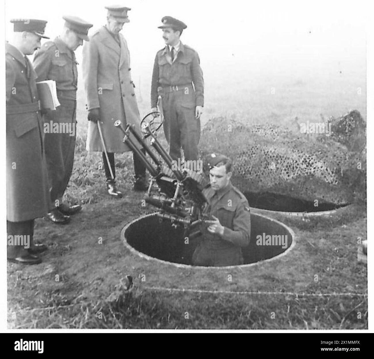 GOC SOUTHERN COMMAND VISITS MUSTANG SQUADRON - An ack-ack gun pit is ...