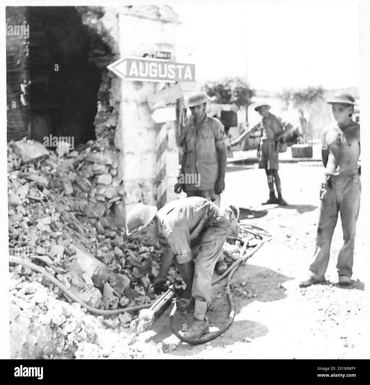 Royal Engineers of the British Army clear roadblocks in Villasmundo ...