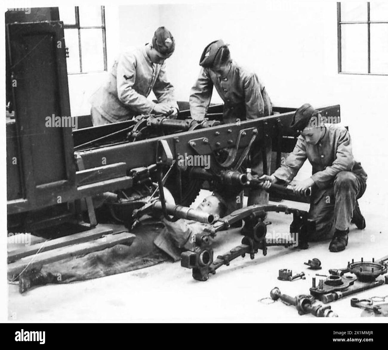 ARMY TECHNICAL SCHOOL R.A.O.C. CHEPSTOW - At work on a lorry chassis ...