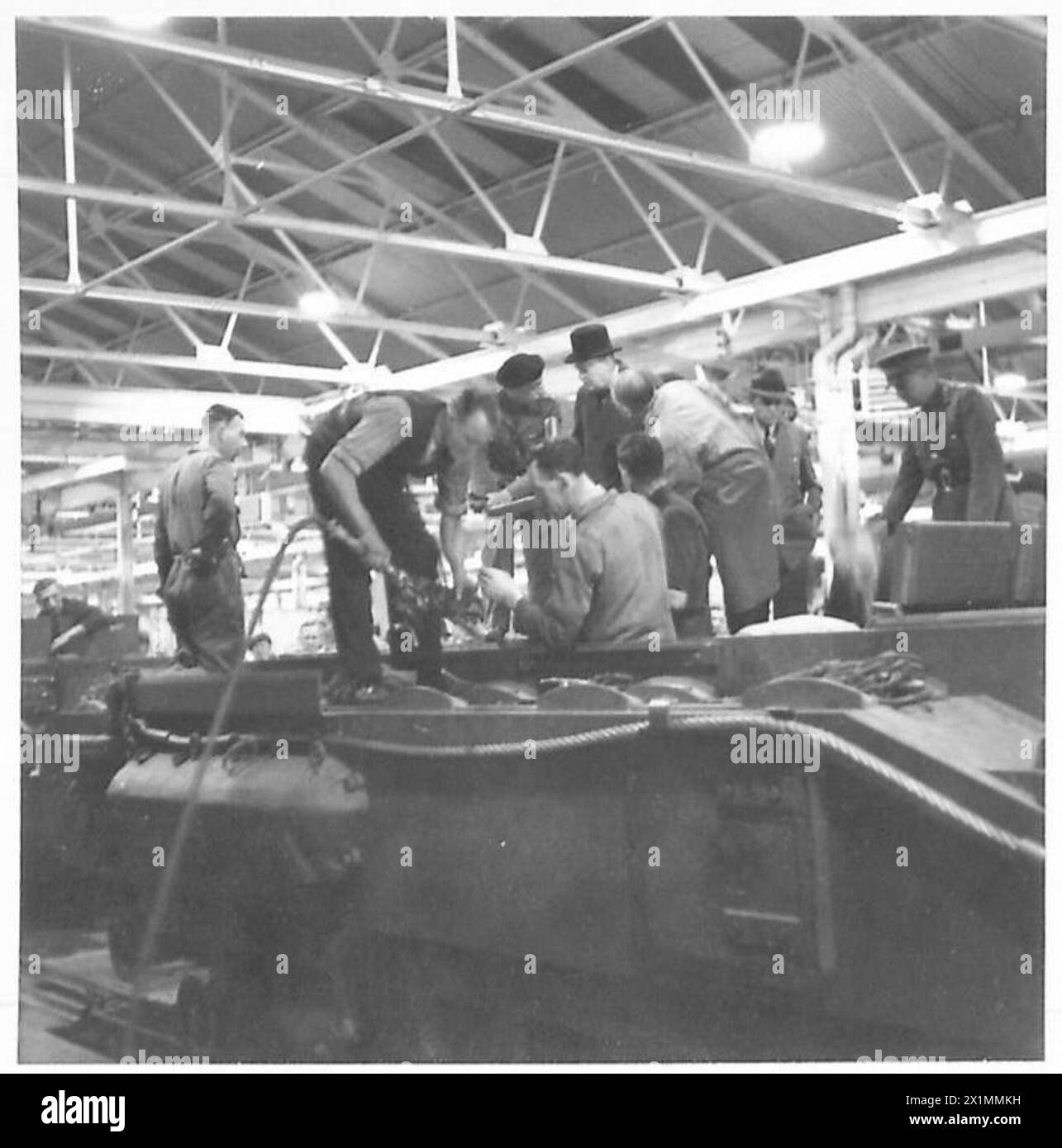 PRIME MINISTER AT TANK FACTORY - Mr. Churchill watches a tank being ...