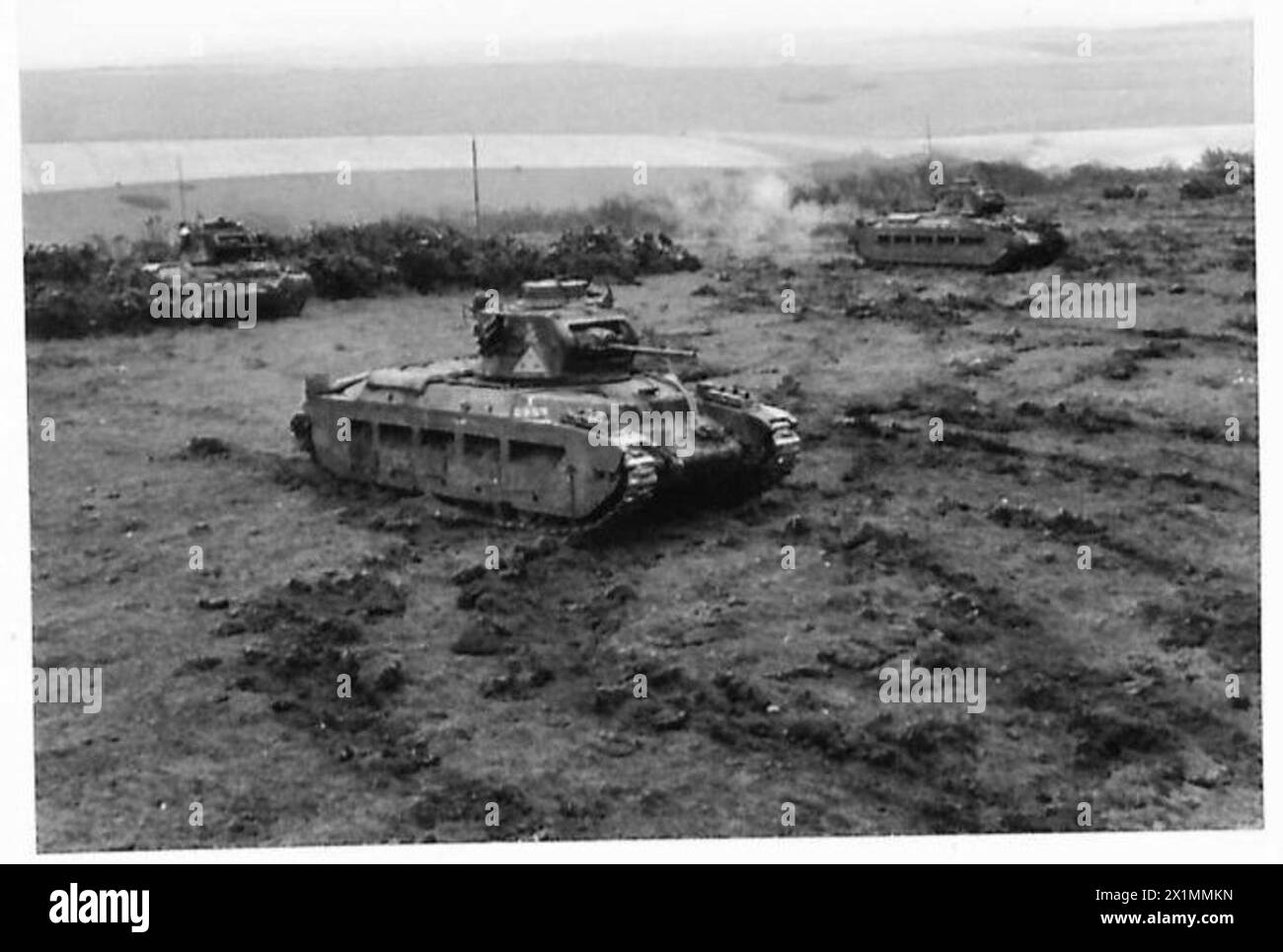 Tanks operate on a hilltop during British Army training exercises ...