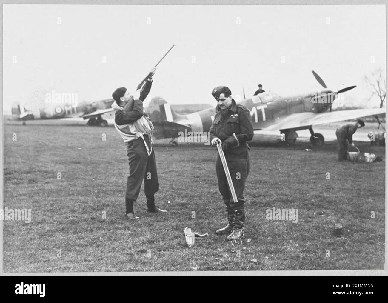 Pilots of the Bombay Squadron engage in target practice while waiting ...