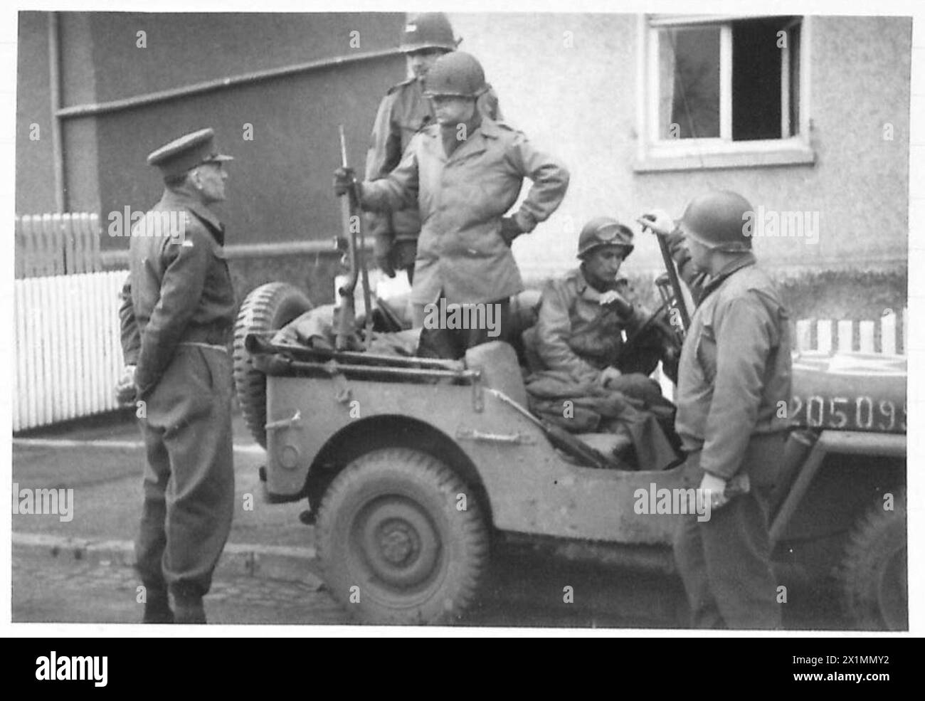 American First Army 99th Division troops release British POWs from ...