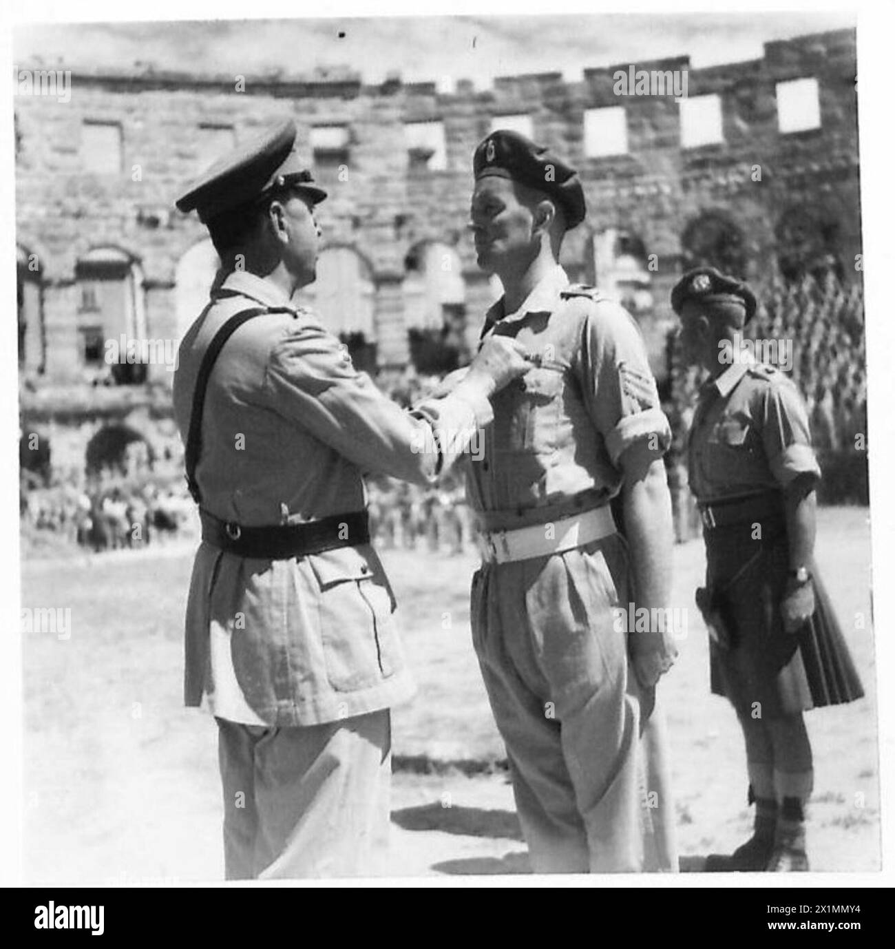 Field Marshal Alexander awards the Military Medal to Sgt. A.L. Walker ...