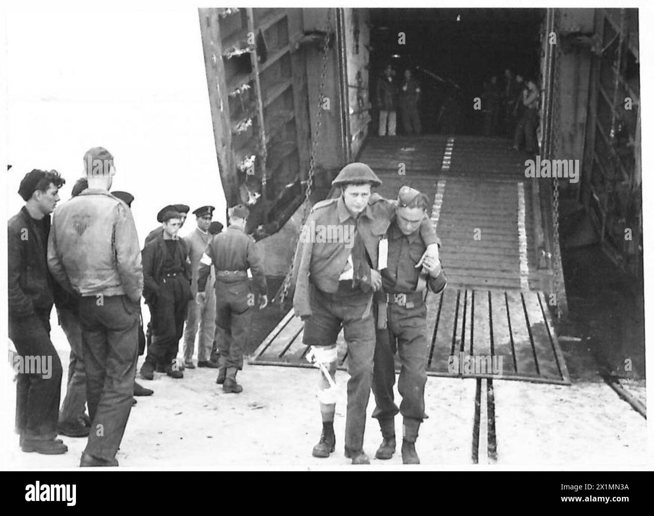 Wounded British soldiers arrive from Normandy, leaving the landing ship ...