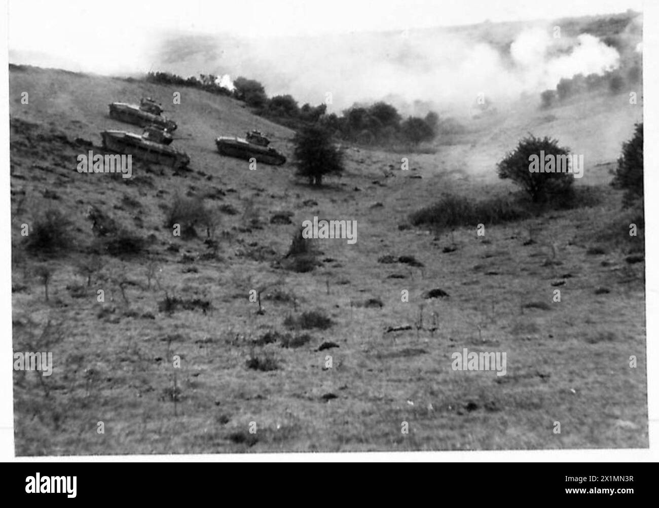 TANKS IN TRAINING - Tanks advancing over hilly country, firing as they ... TANKS IN TRAINING - Tanks advancing over hilly country, firing as they ...