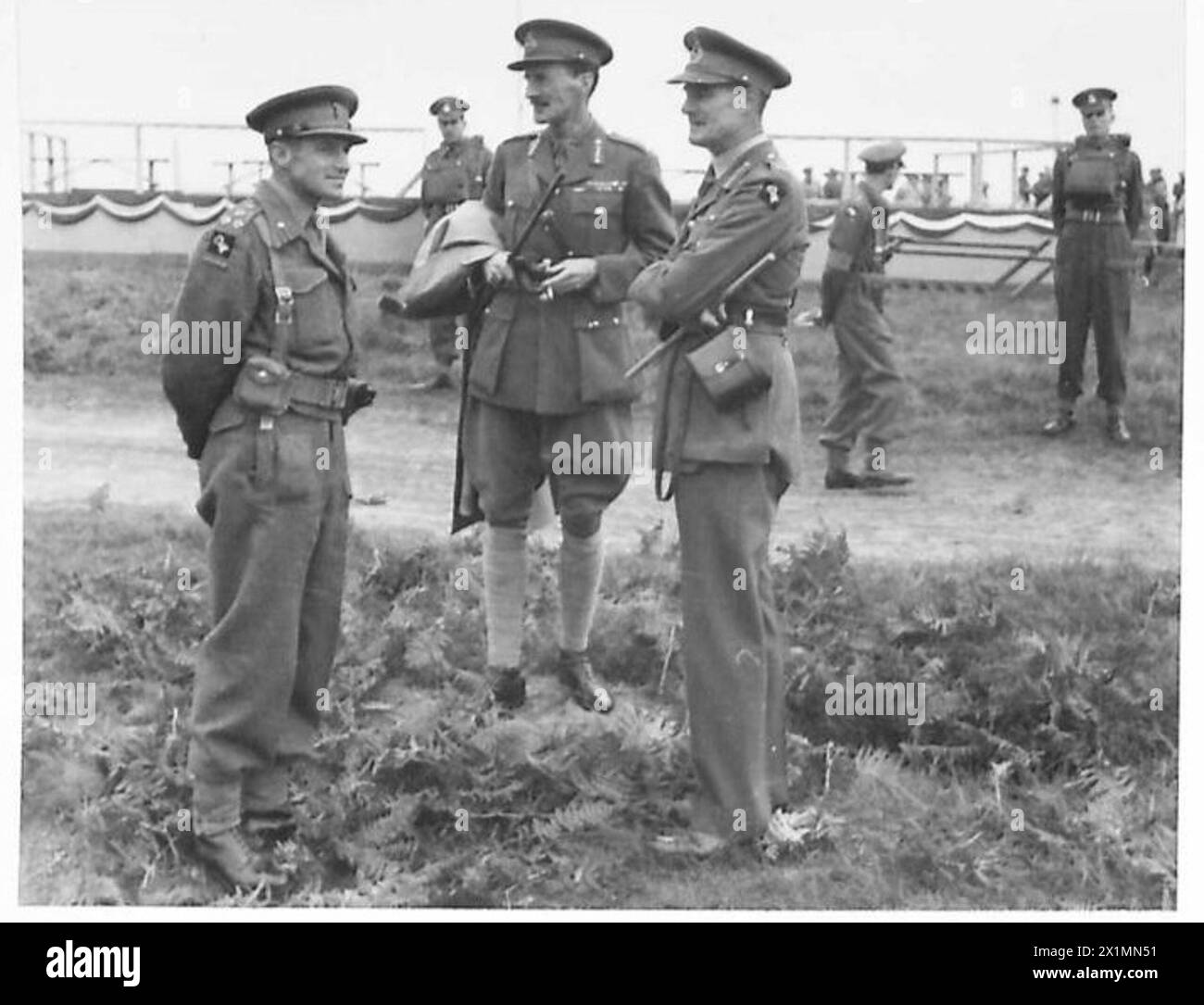 THE KING REVIEWS ARMOURED DIVISION - Brigadier Wyatt (left); Lt. Gen. L ...