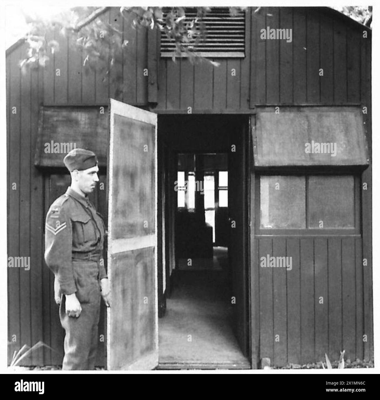 MODEL DEMONSTRATION HUTS - Entrance to cookhouse showing screen doors ...