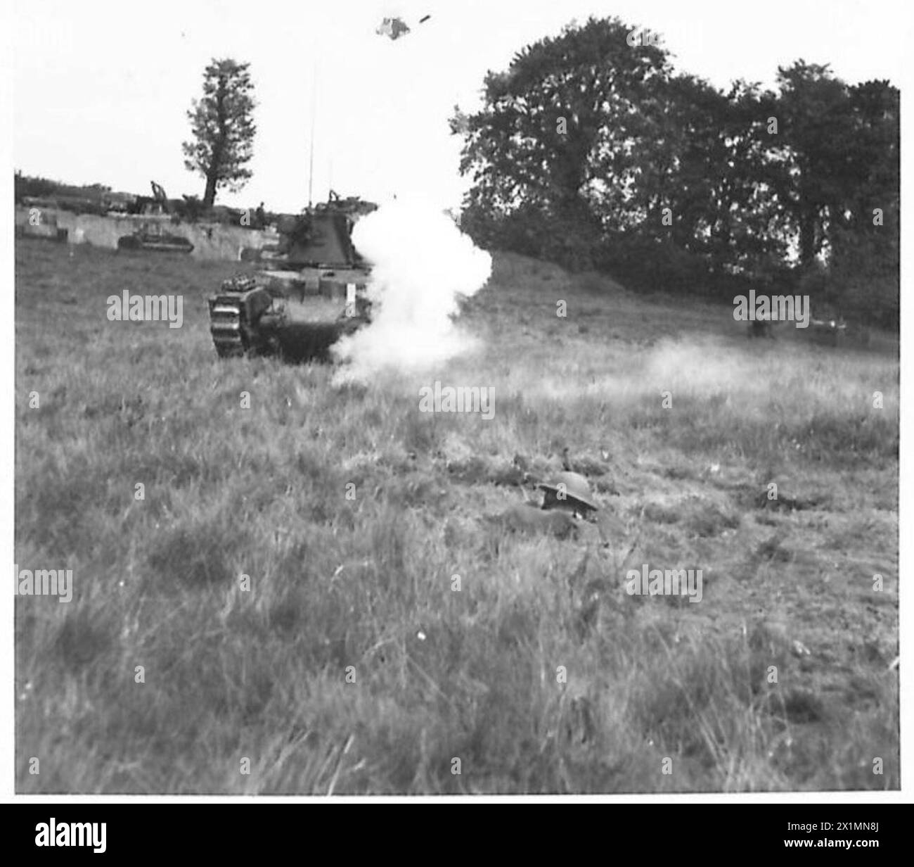 TANK DEMONSTRATION IN NORTHERN IRELAND - Men in slit trenches fire on ...