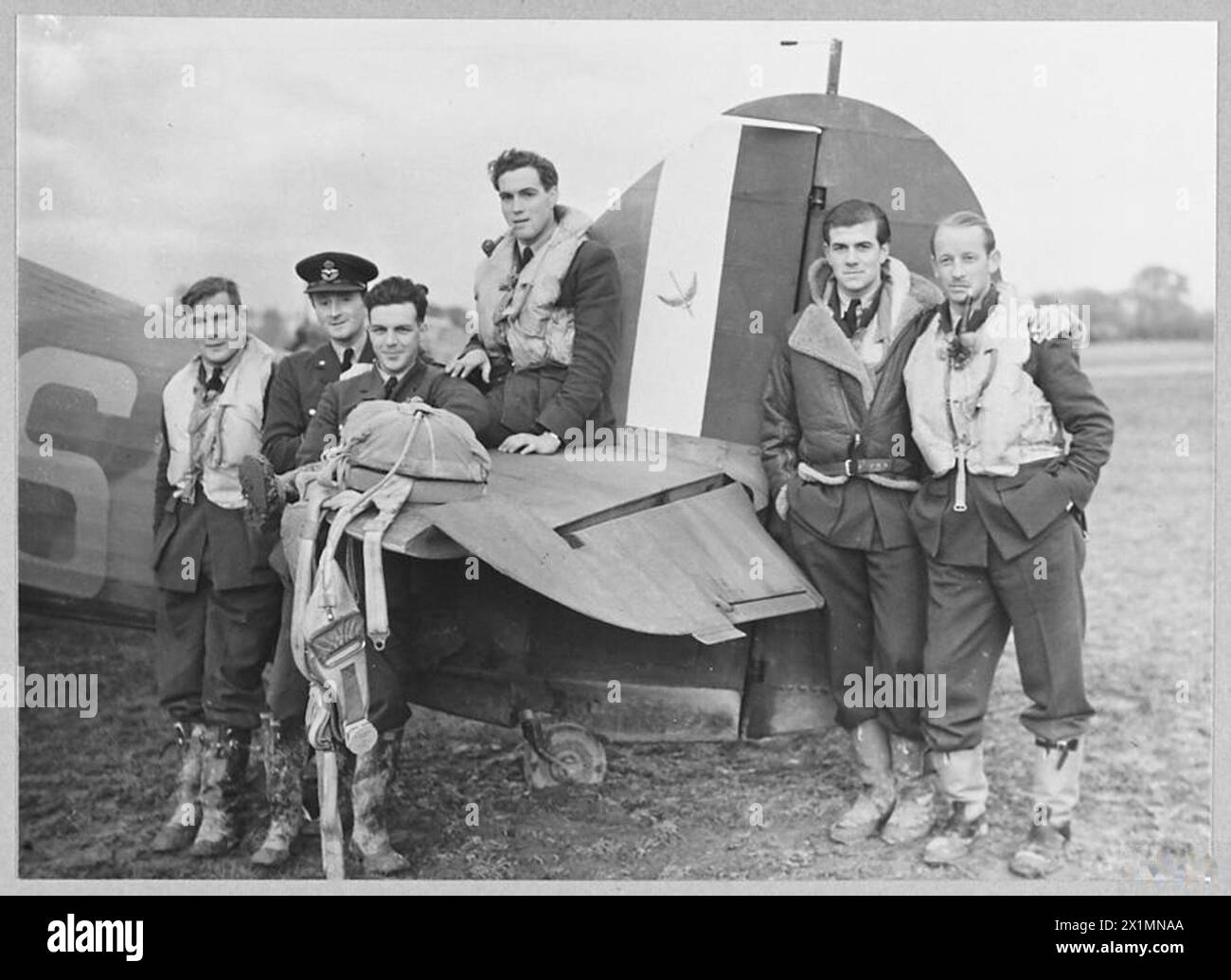In November 1940, pilots of No. 601 Squadron are shown around a ...
