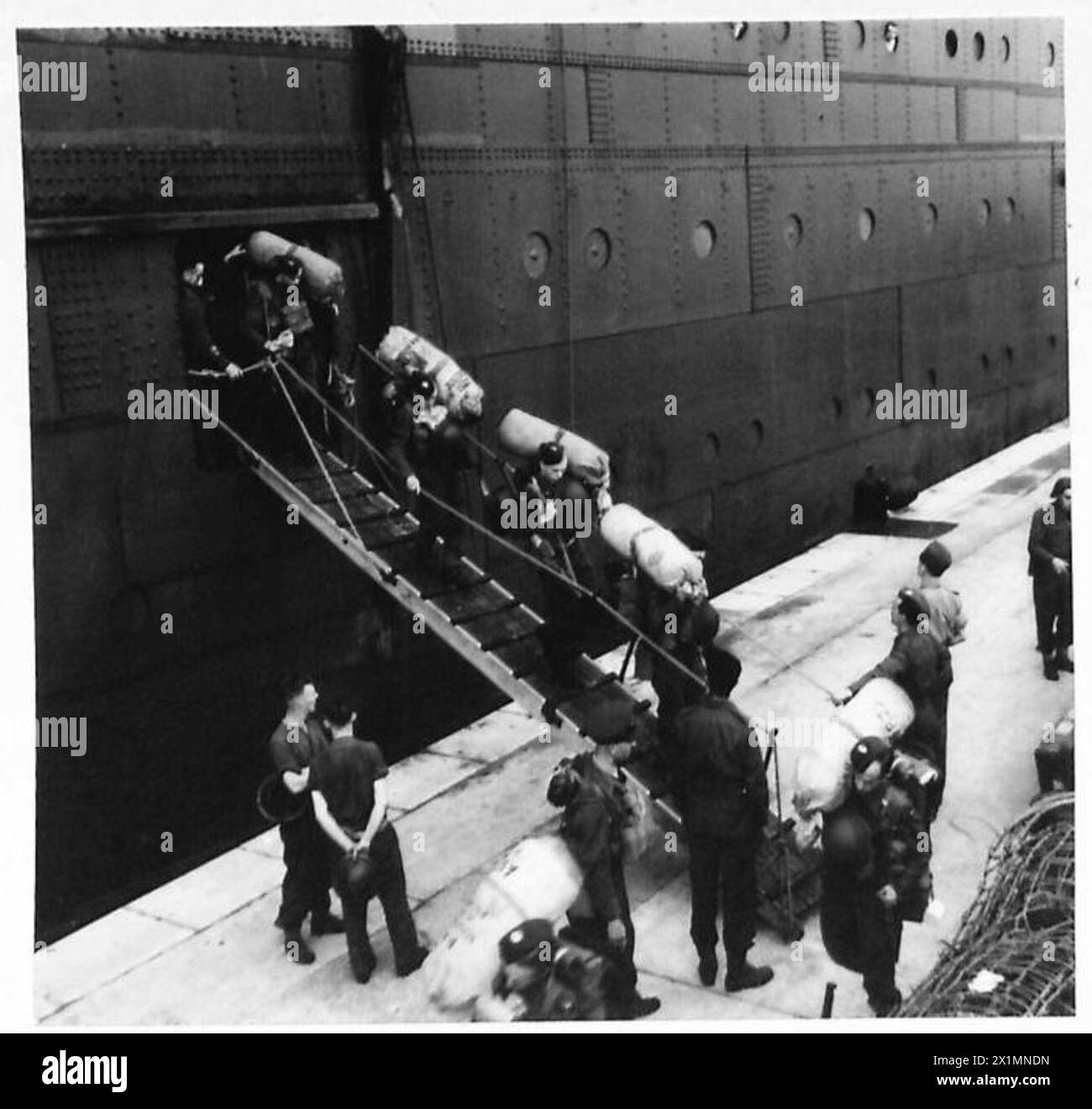British troops and equipment are disembarked from troopship SS Duchess ...
