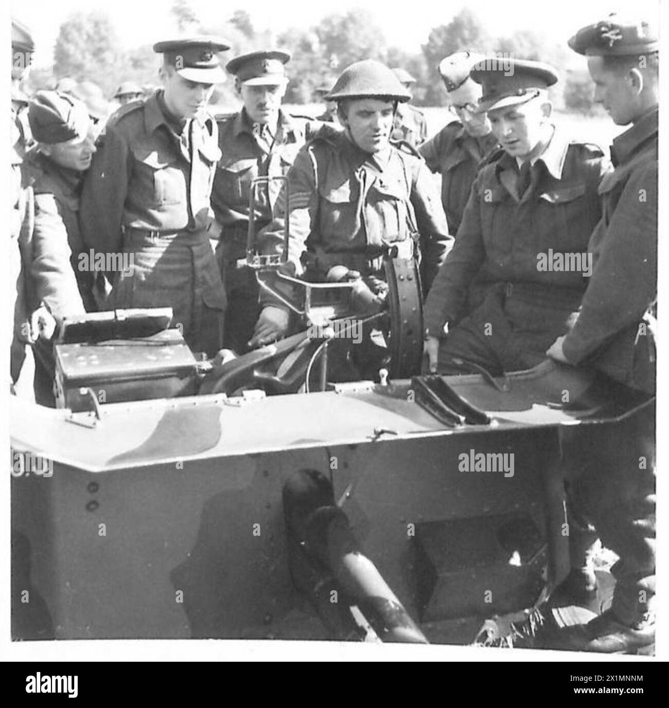 Junior Army officers receive instruction around a 2-pounder anti-tank ...