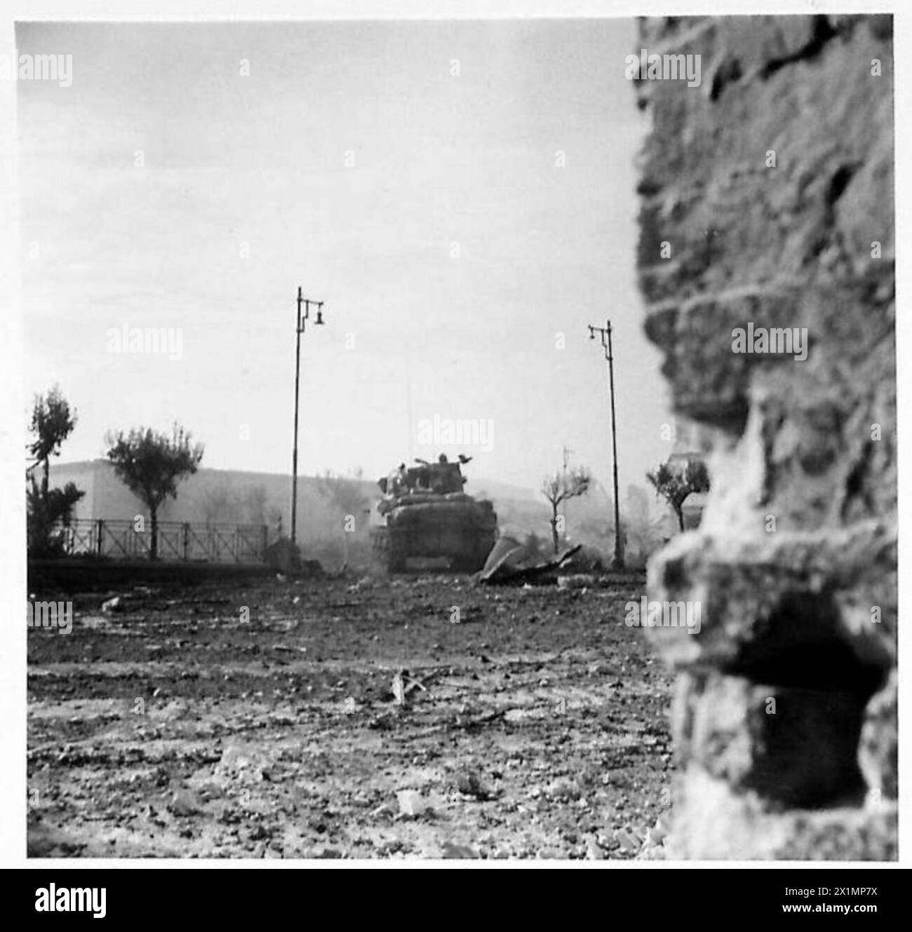 A Sherman tank patrols the southern outskirts of Ortona during the ...