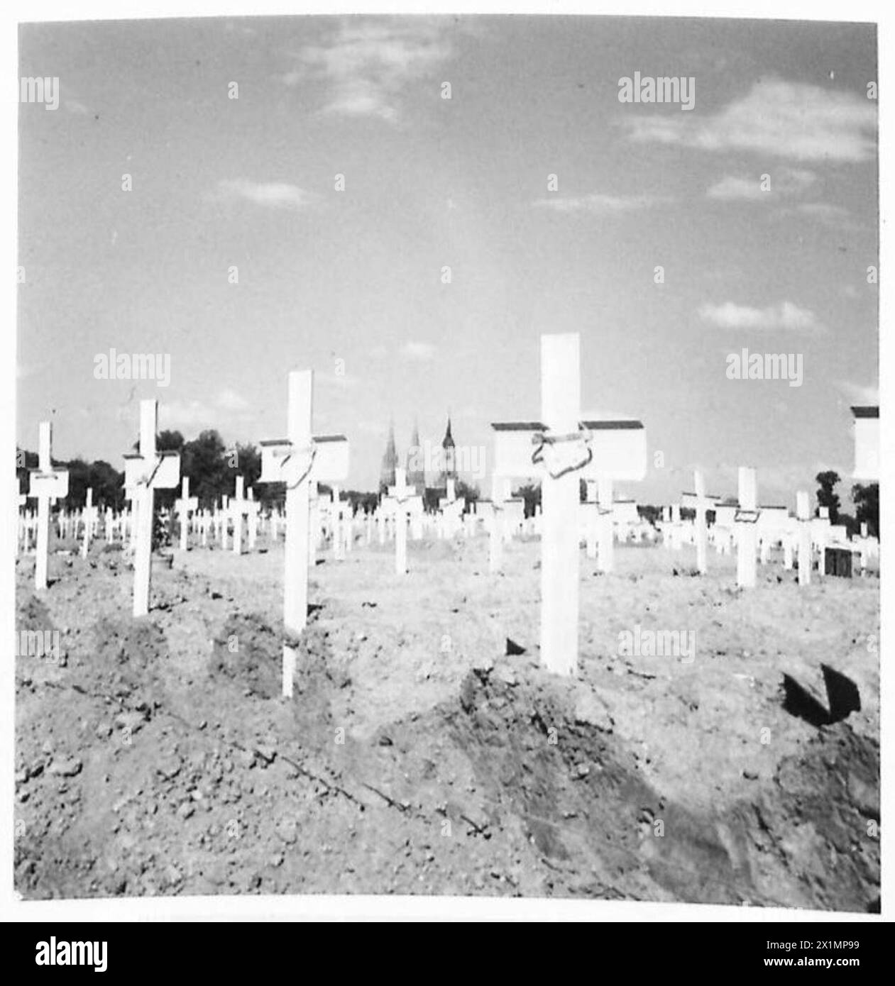 On the outskirts of Bayeux, a military cemetery is seen with Caen ...