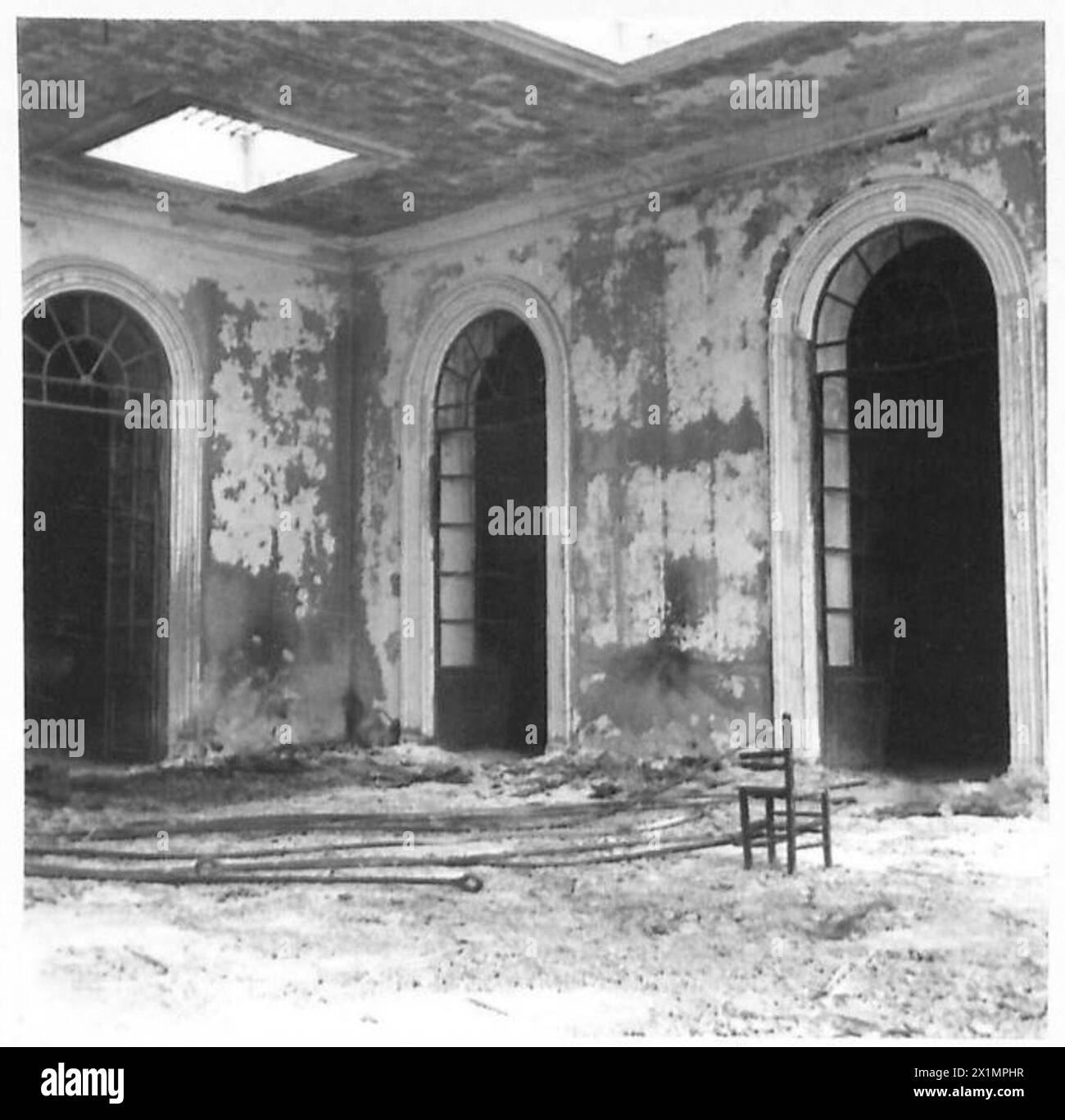 The interior of a damaged library in Naples, Italy, shows destruction ...