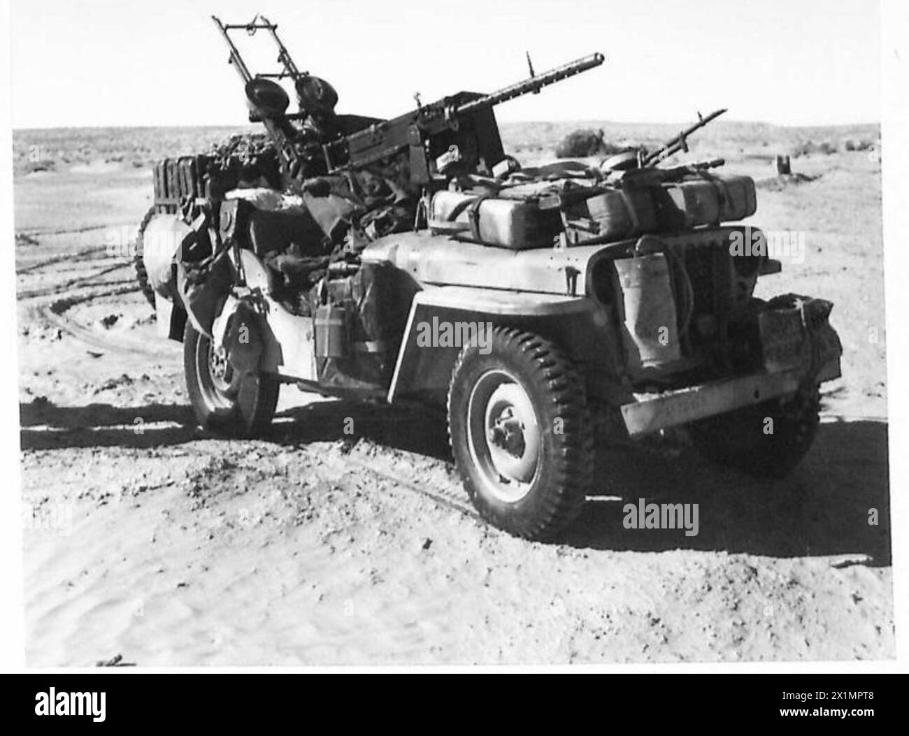 A British Army patrol Jeep equipped with single and twin Vickers 'K ...