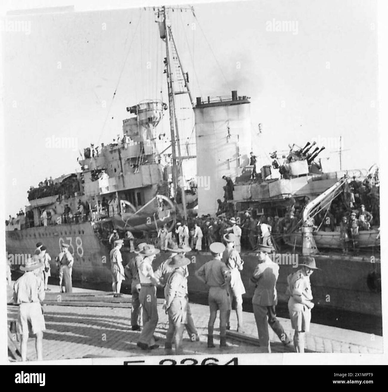ARRIVAL OF EVACUATED TROOPS FROM CRETE - Colonial troops watching one ...