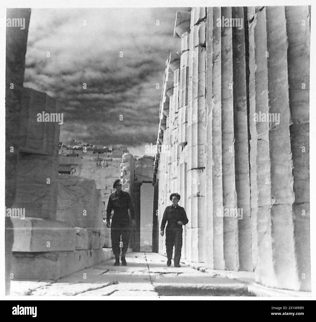 Two British Army soldiers walk beneath a colonnade of the Parthenon in ...
