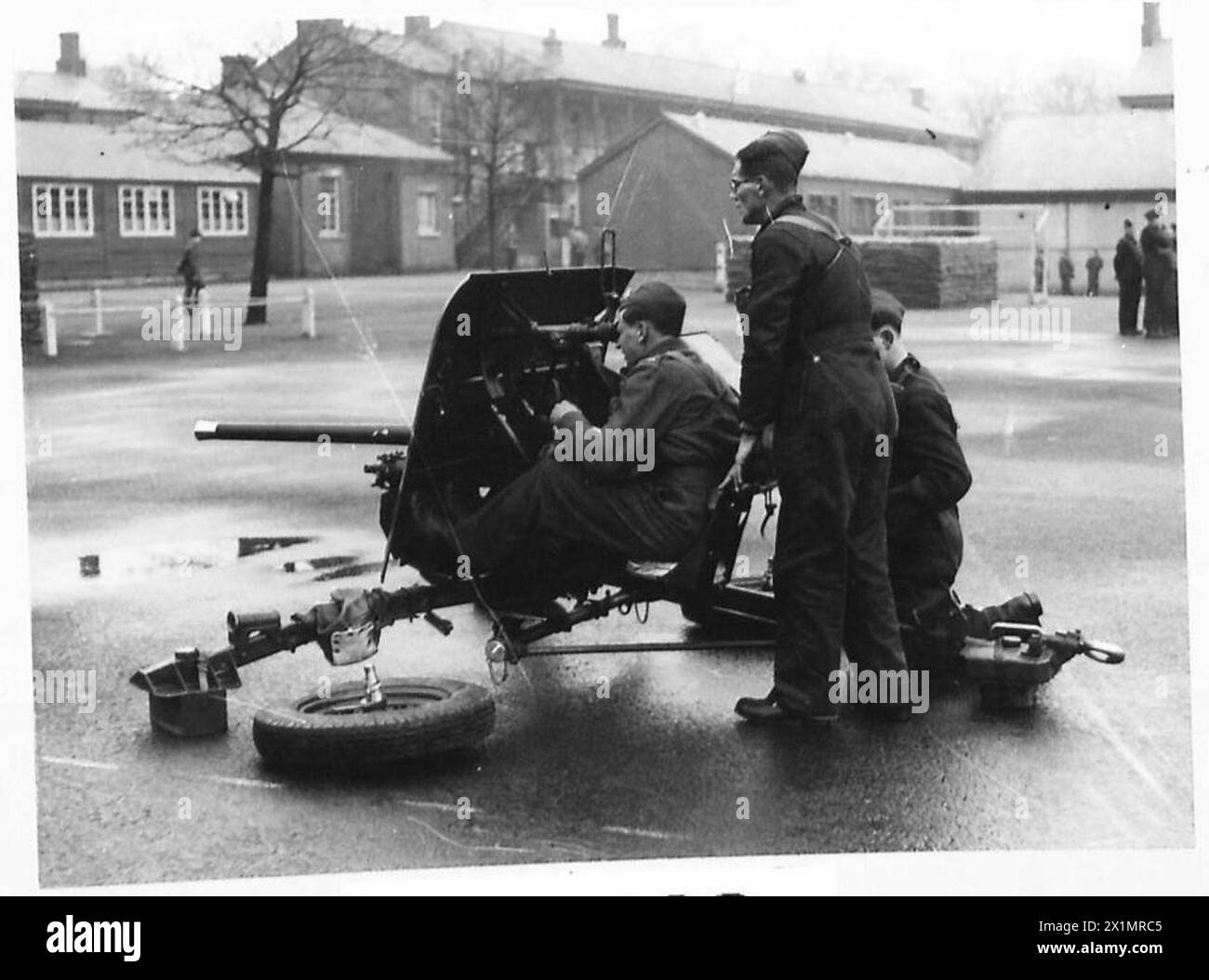 Anti-tank gun crews of the British Army conduct sighting practice ...