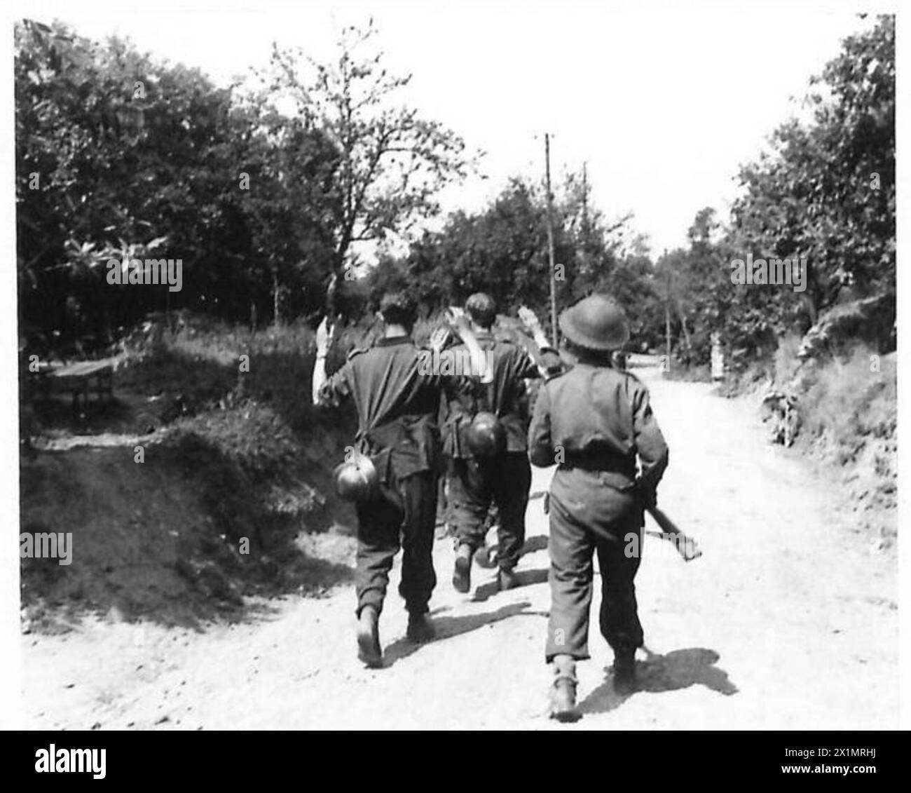 THE ATTACK SOUTH OF CAEN - Prisoners being led away from the fighting ...