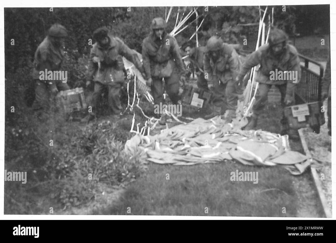 Troops in Arnhem during Operation Market Garden, September 1944, unpacking supplies delivered by ...