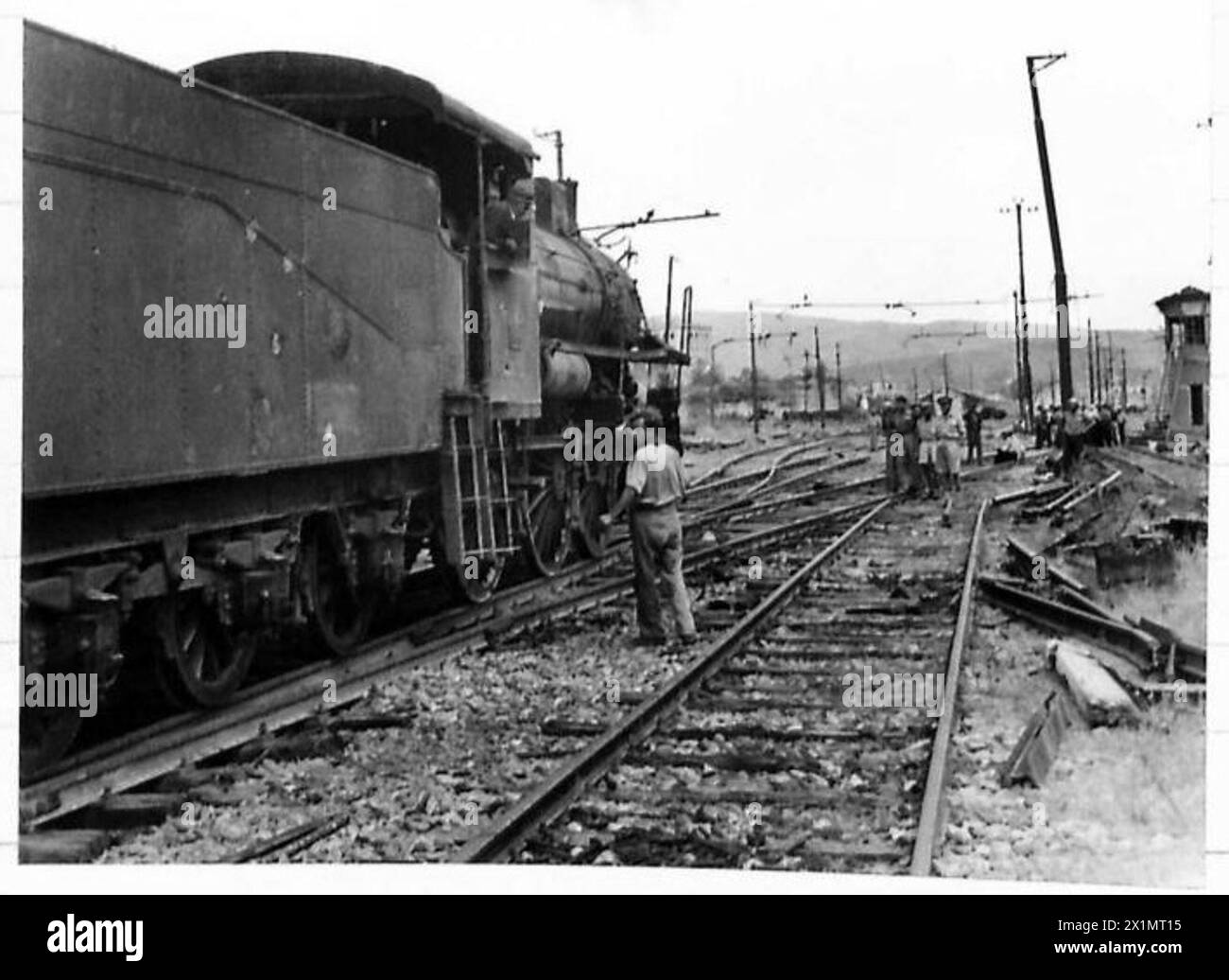 EIGHTH ARMY : RAILWAY RECONSTRUCTION - This salvaged engine, running on ...