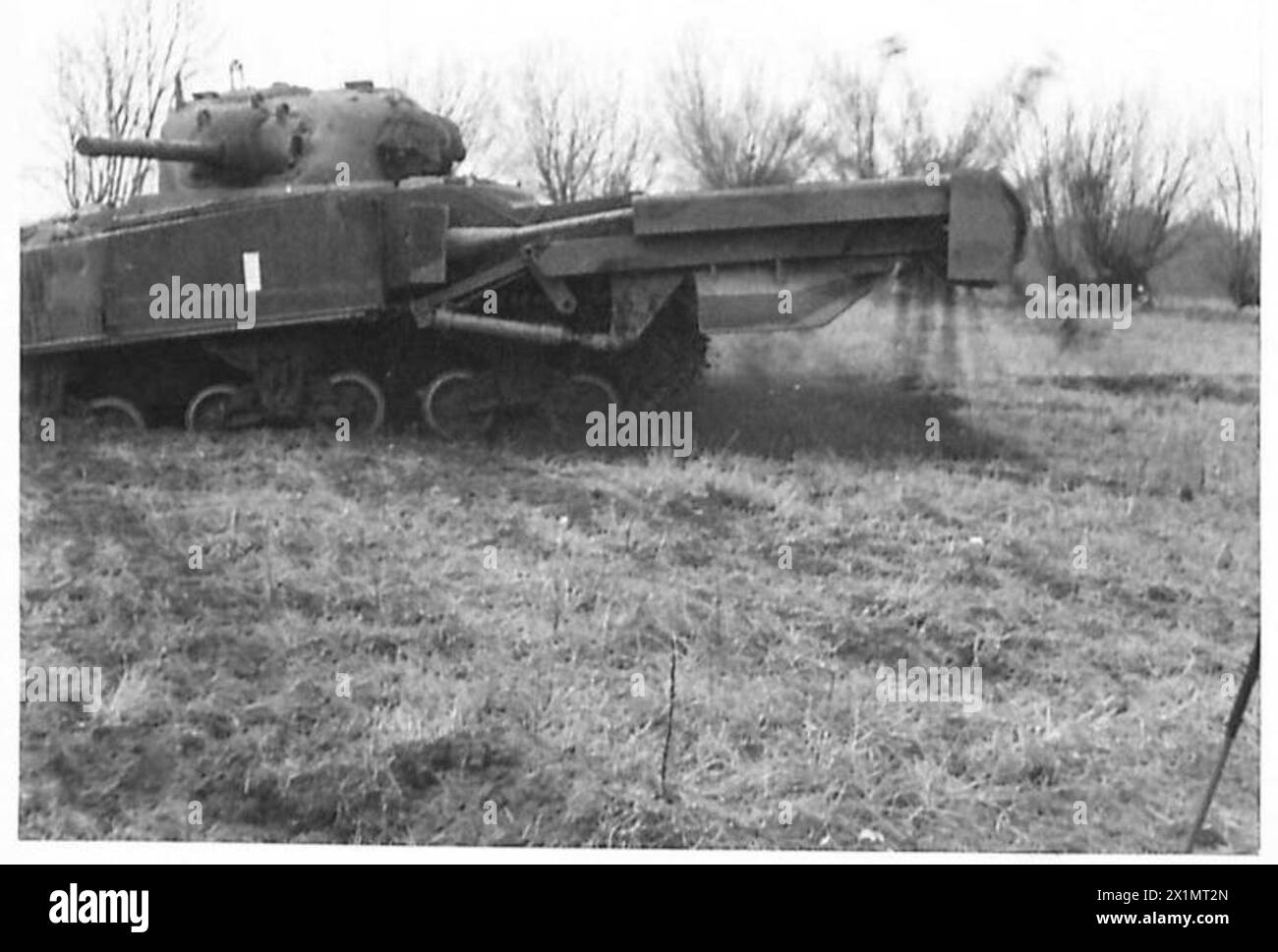 A British Army 79th Armoured Division flail tank operates during a mine ...