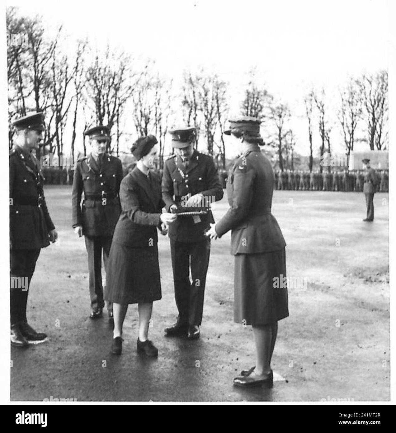 SHAMROCK DAY - The wife of the Commanding Officer gives shamrock to an ...