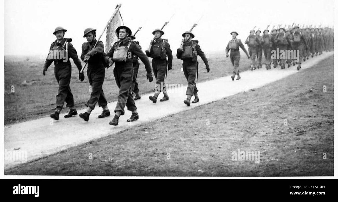 Czech troops march past with their regimental colors in Leamington ...