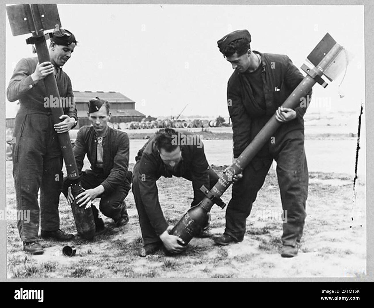 RAF armourers assemble rocket projectiles for Typhoon fighter-bombers ...