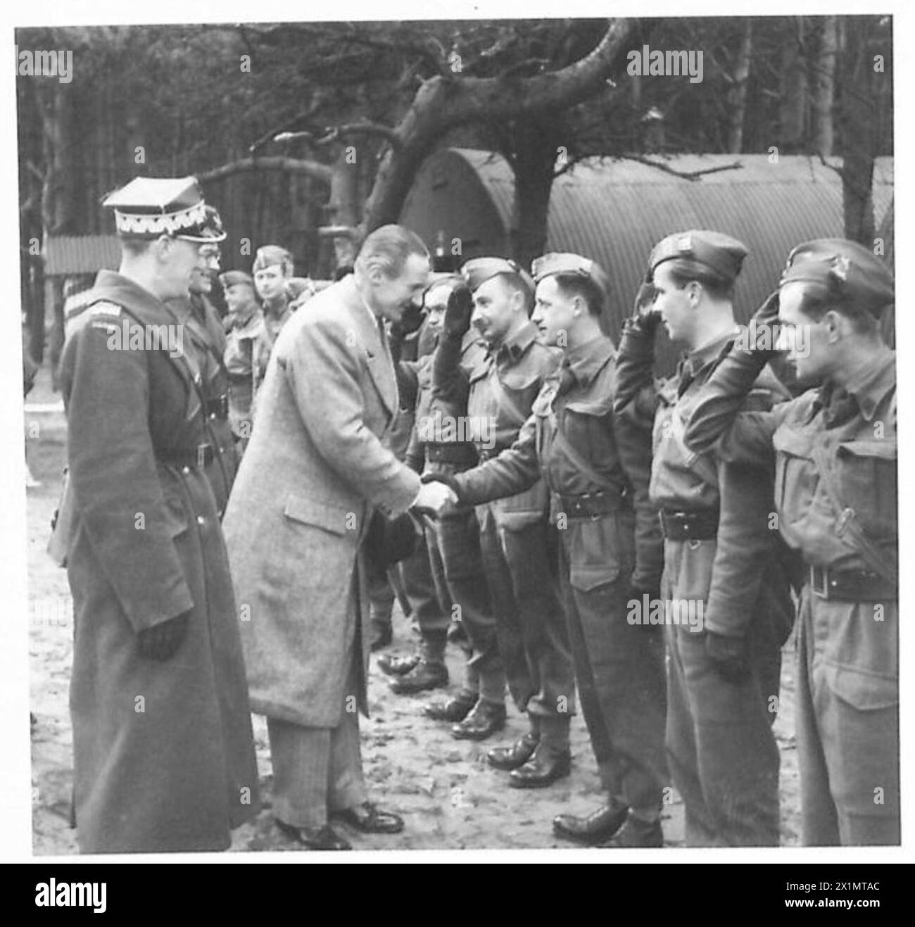 American Ambassador Anthony Drexler Biddle shakes hands with officers ...