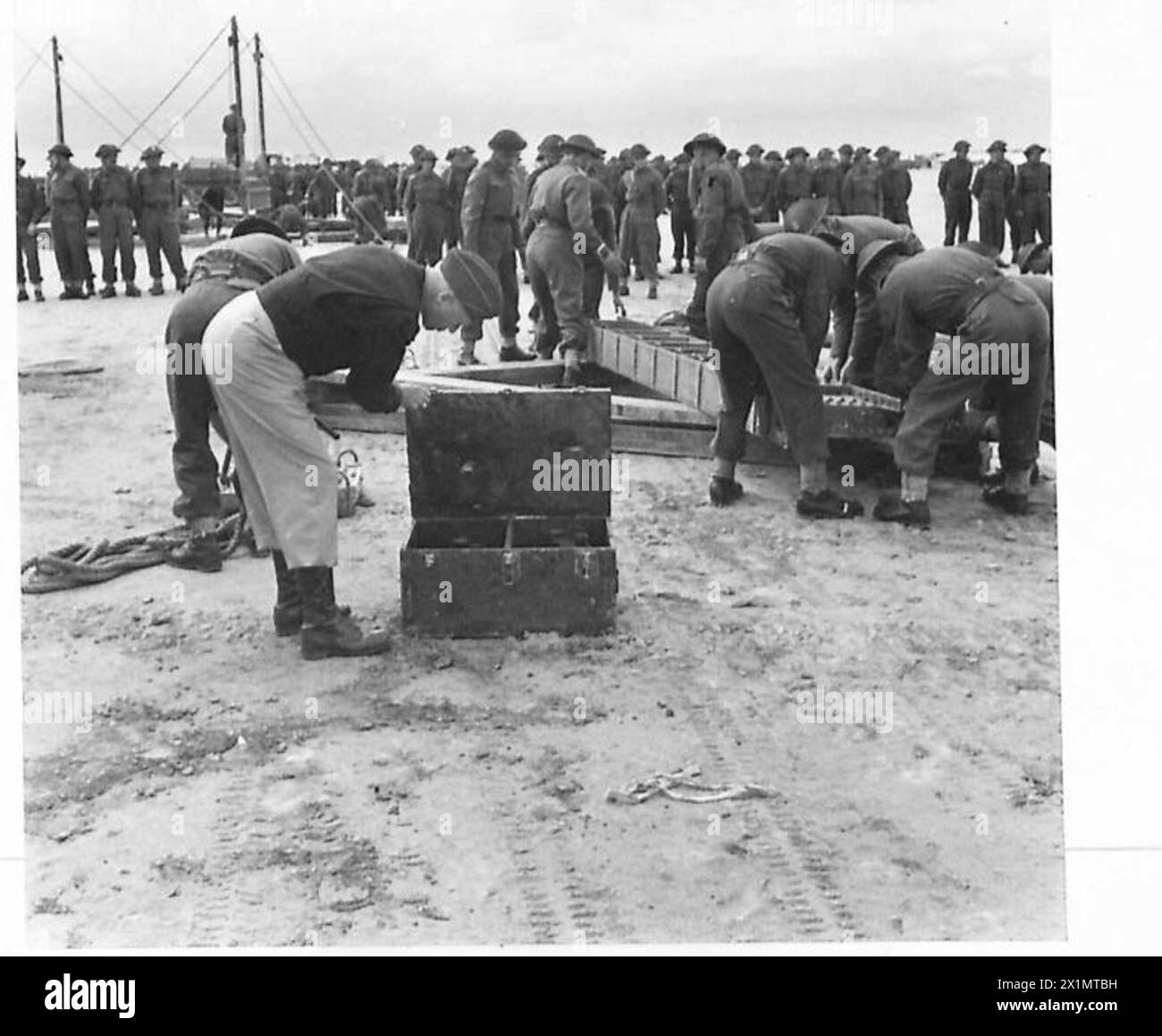 General George Patton examines a box while engineers of the 2nd Polish ...