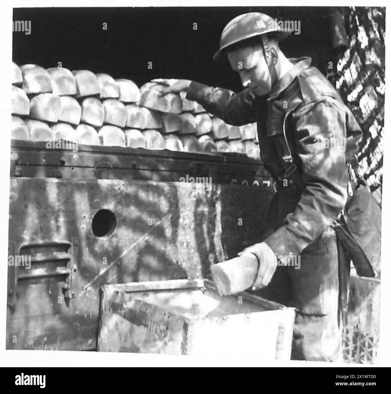 Royal Army Service Corps personnel at Crystal Palace load bread into a ...