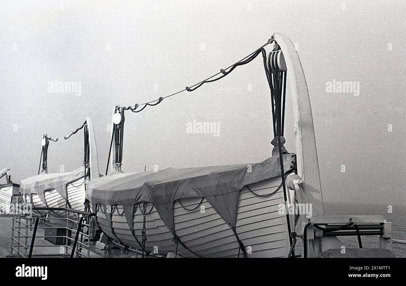 1950s, historical, a row of lifeboats suspended on davits on the MS ...