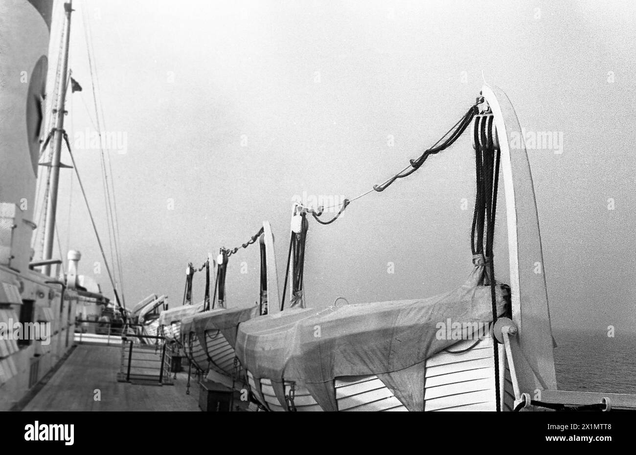 1950s, historical, a row of lifeboats suspended on davits on the MS ...