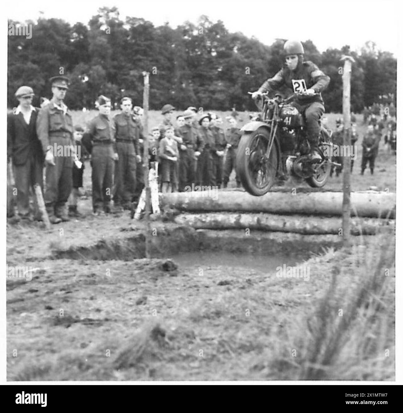 Competitors participate in a British Army event involving jumping a ...