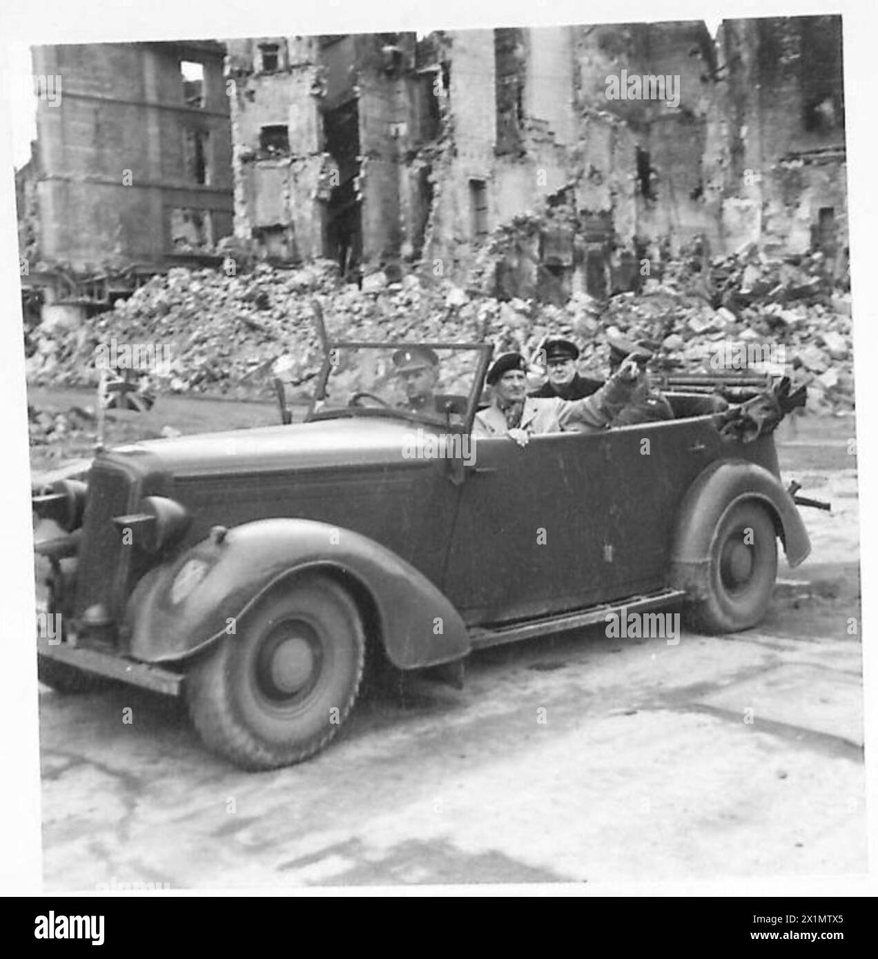 Prime Minister Churchill, General Montgomery, and General Dempsey drive ...