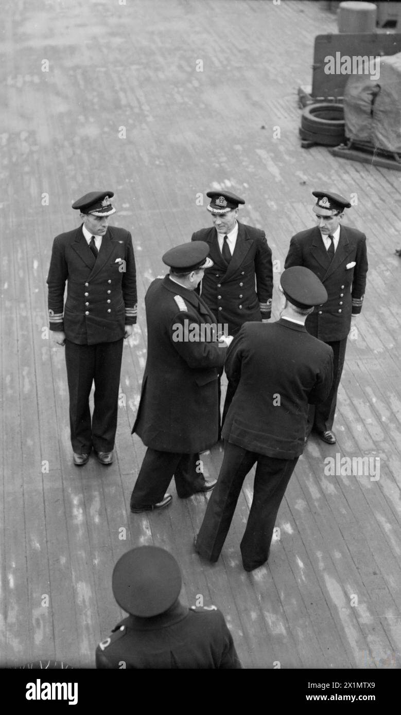Admiral Sir Max Horton visits HMS Forth at Holy Loch, speaking with ...